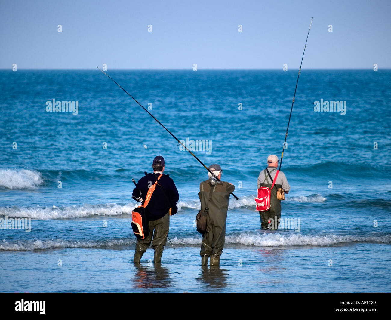 Sea anglers fishing from the beach Stock Photo - Alamy