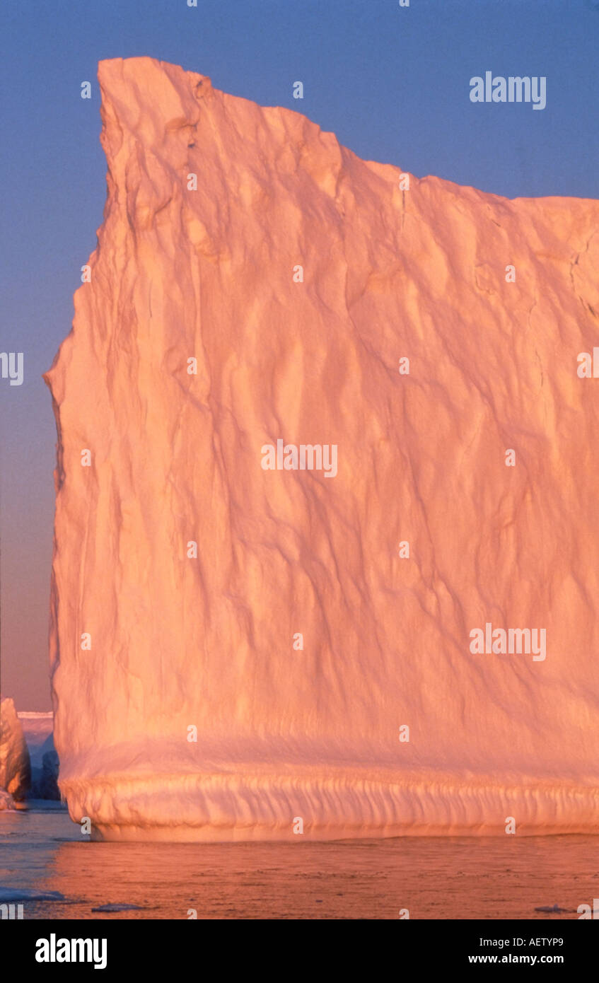 Massive pink iceberg at sunset Stock Photo - Alamy
