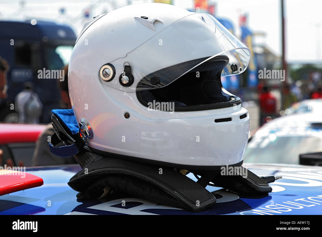 racing helmet on top of a racing car Stock Photo - Alamy