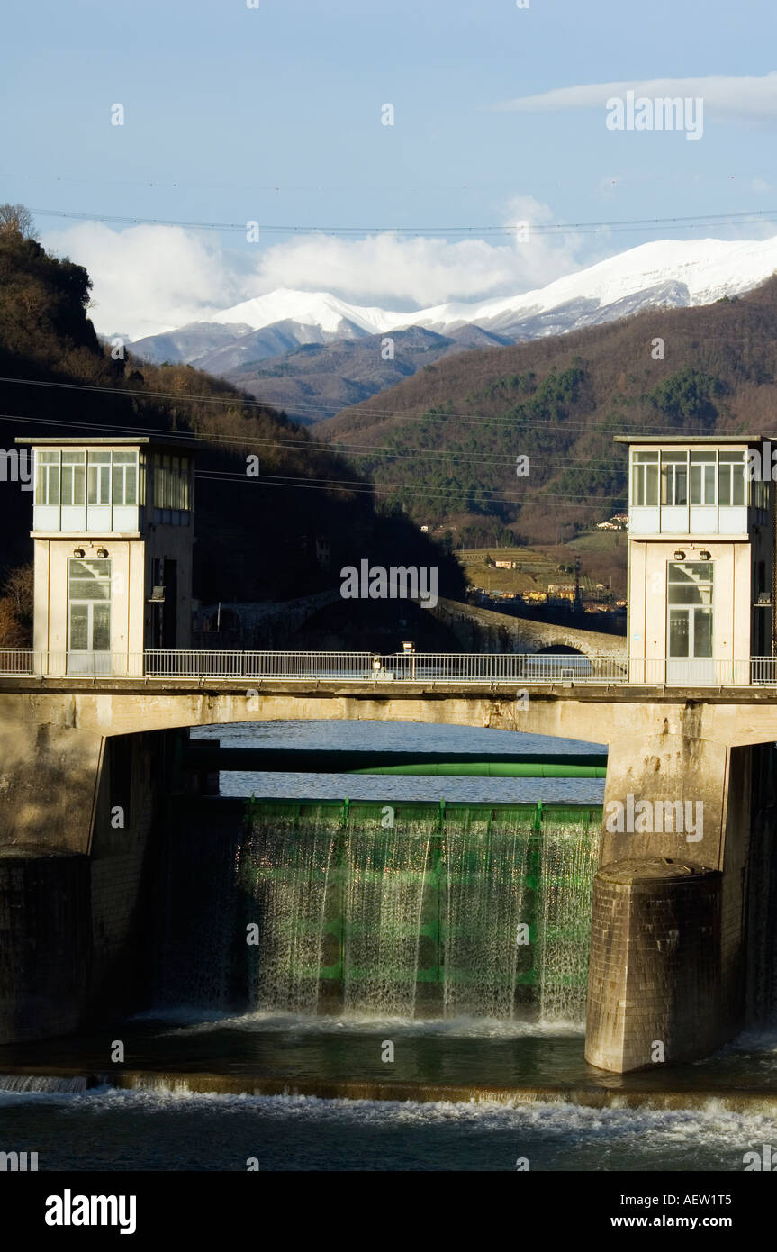 flood gates river with snow capped mountain backdrop Borgo a Mozanno ...