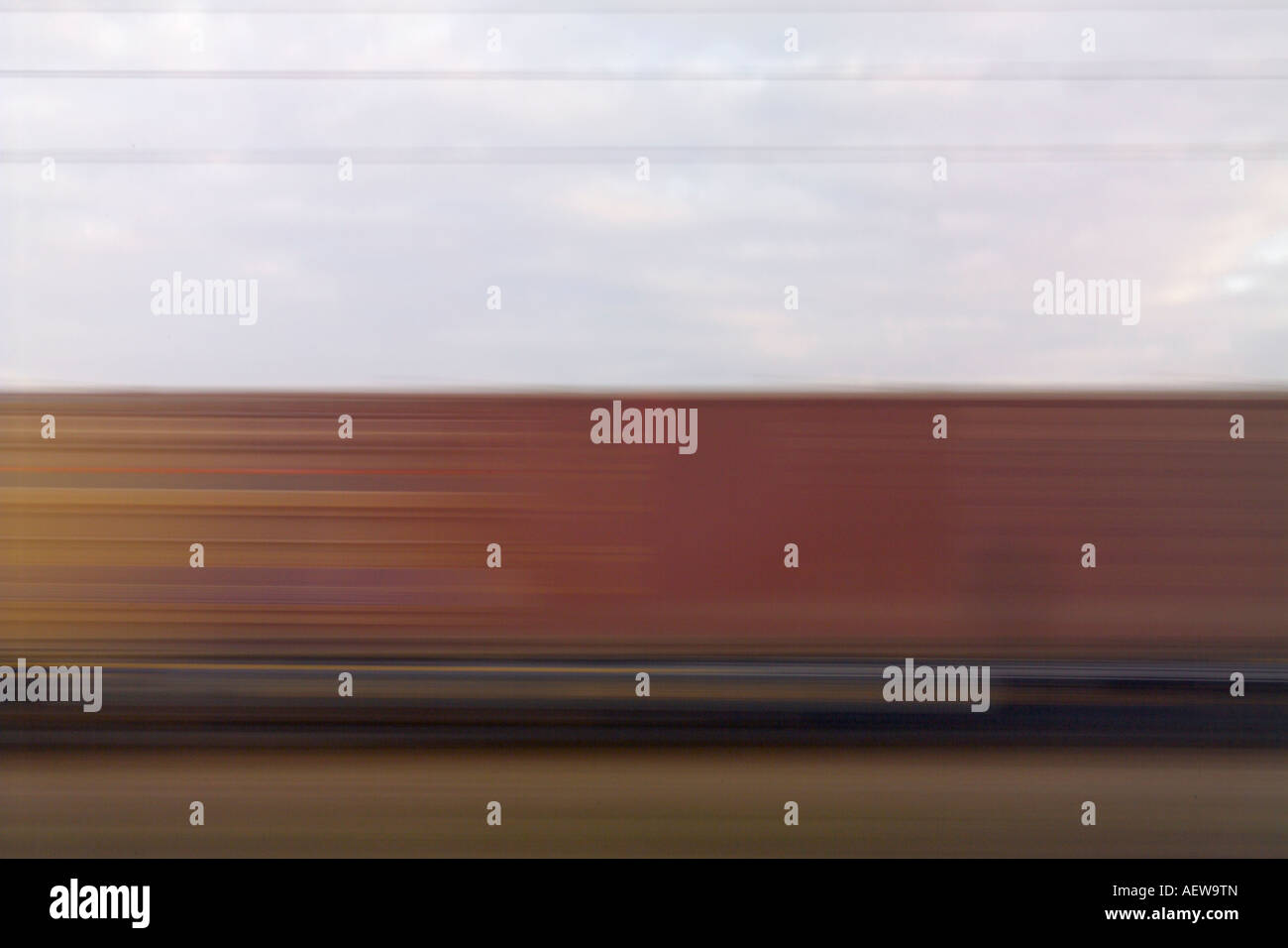 view of a goods train from a moving train Stock Photo - Alamy