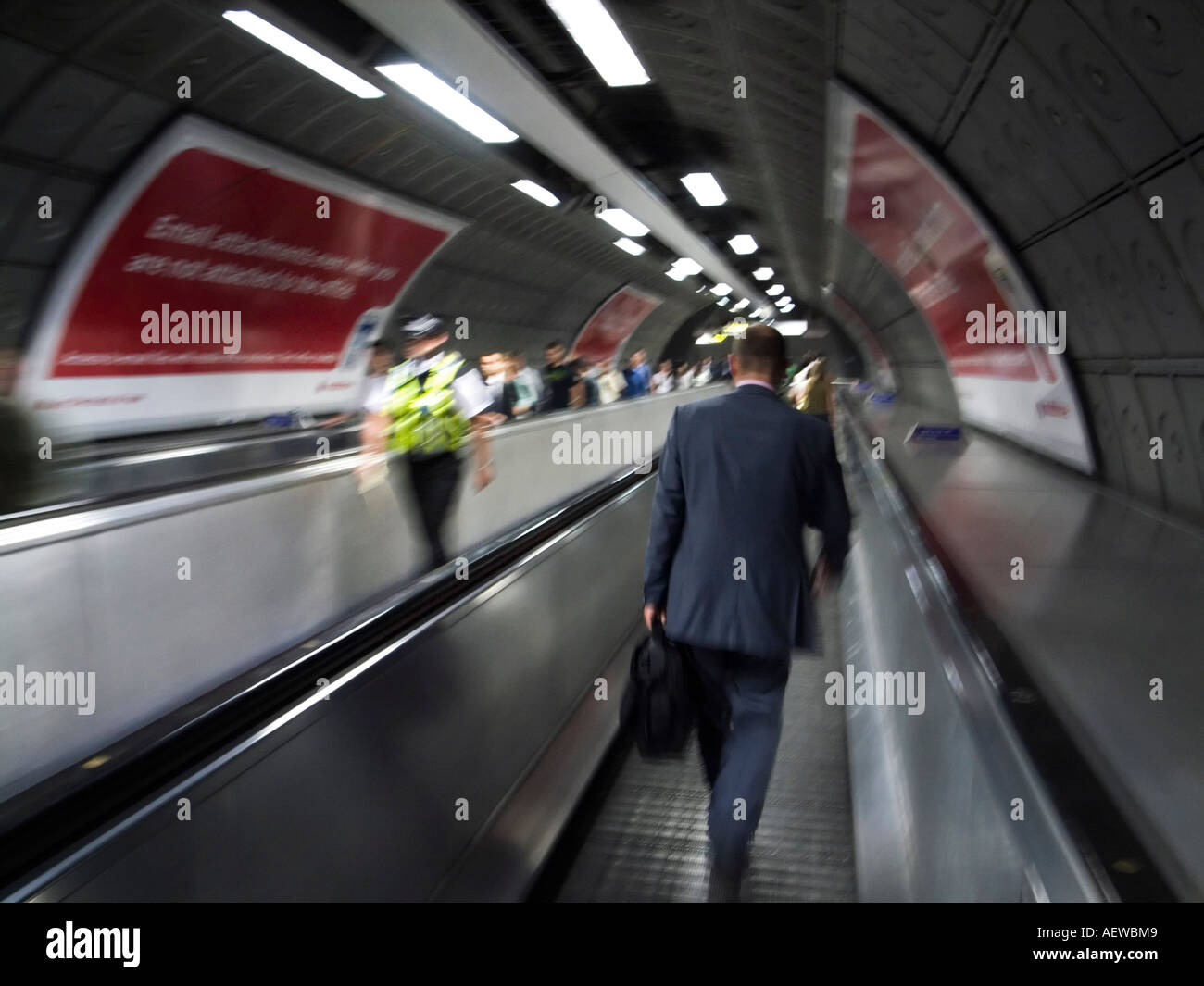 commuters and a police officer in The London Underground Stock Photo ...