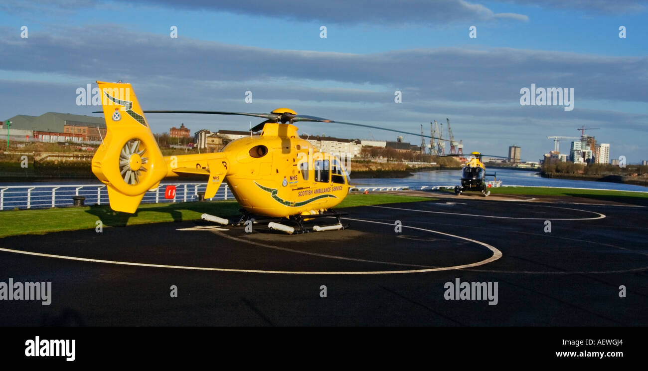 Scottish air ambulance and police helicopters on the banks of the river ...