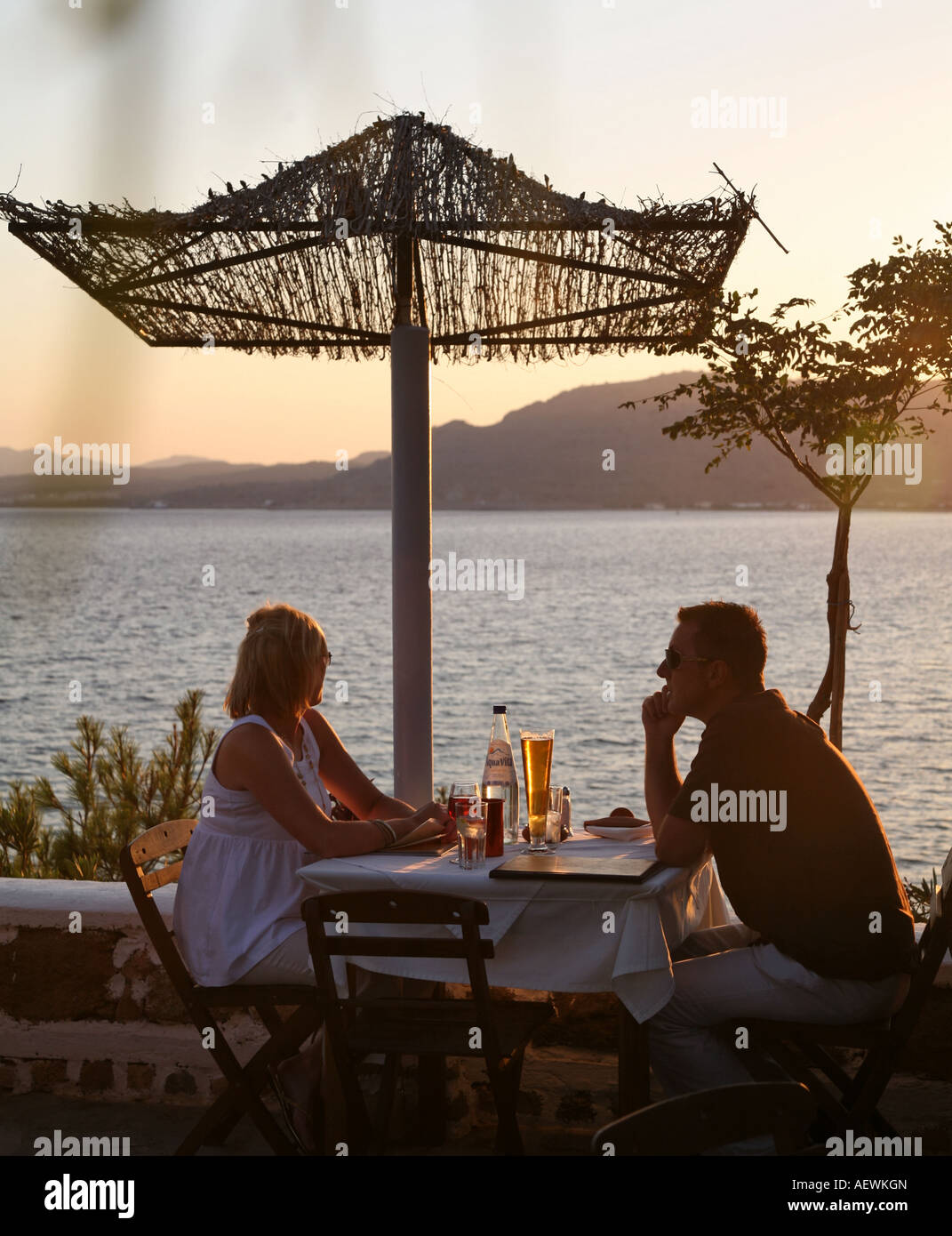 People At Taverna Overlooking Pefcos Beach At Sunset Rhodes Greek ...