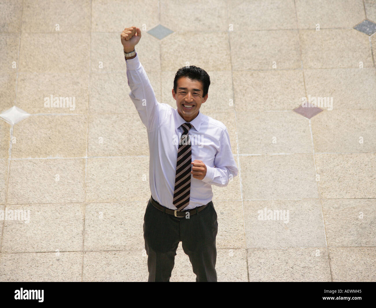 High angle view of a businessman standing with his hand raised Stock ...