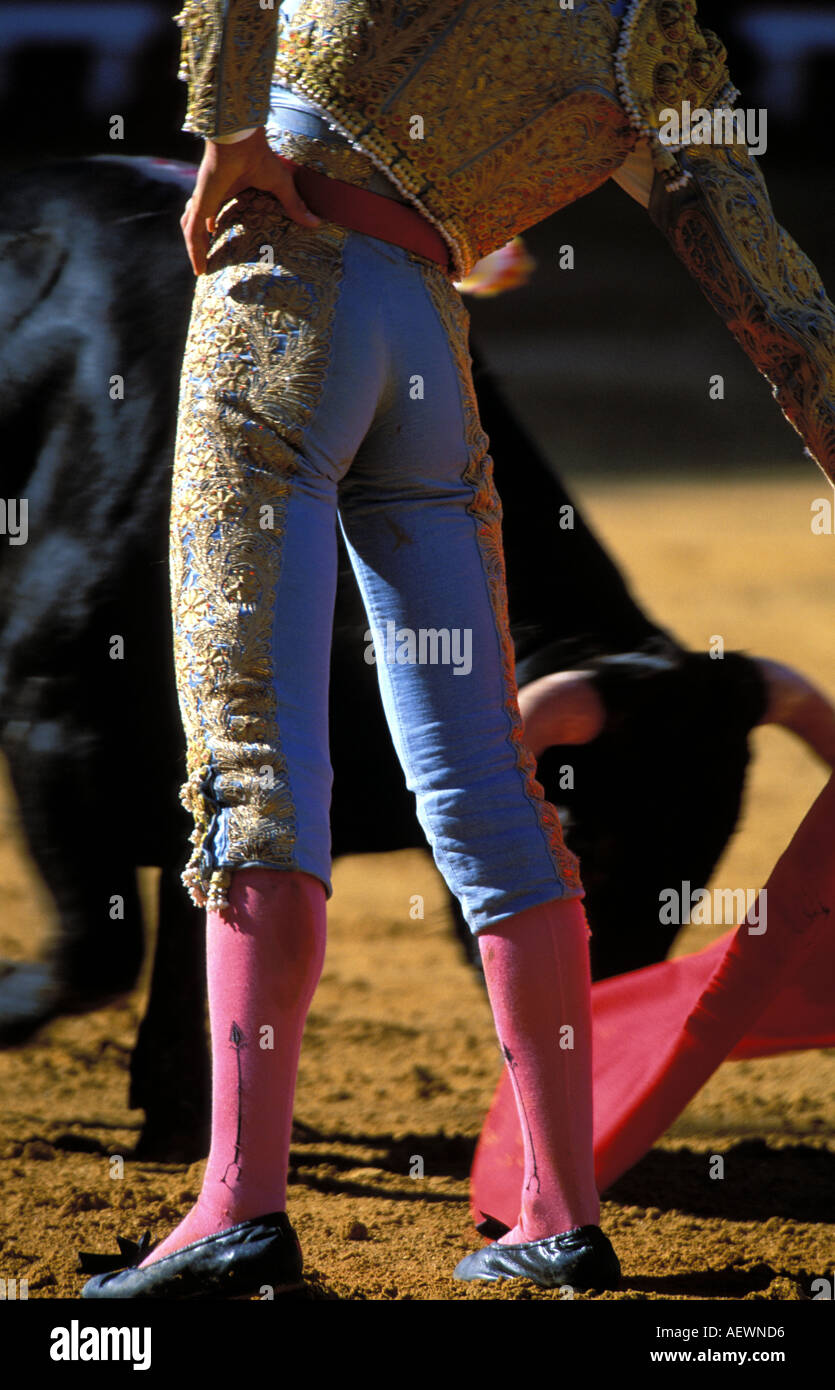 Bullfighter and bull in the arena Stock Photo - Alamy