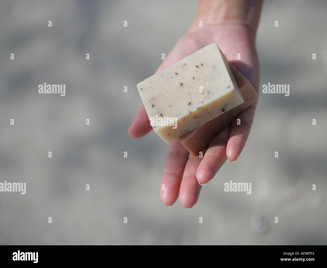 Human hand holding soaps Stock Photo - Alamy