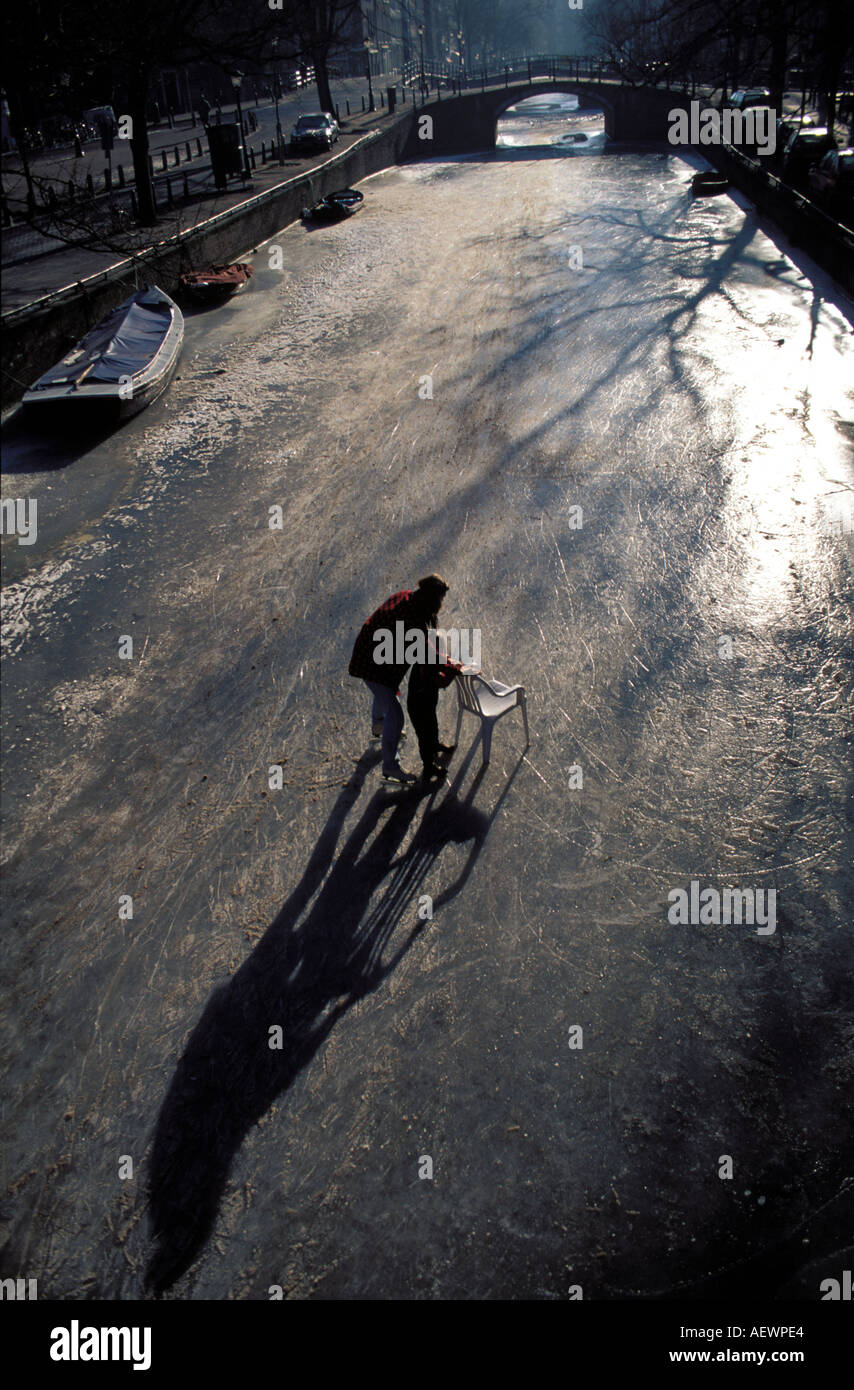 Amsterdam learning to skate behind a chair on the keizersgracht Stock ...