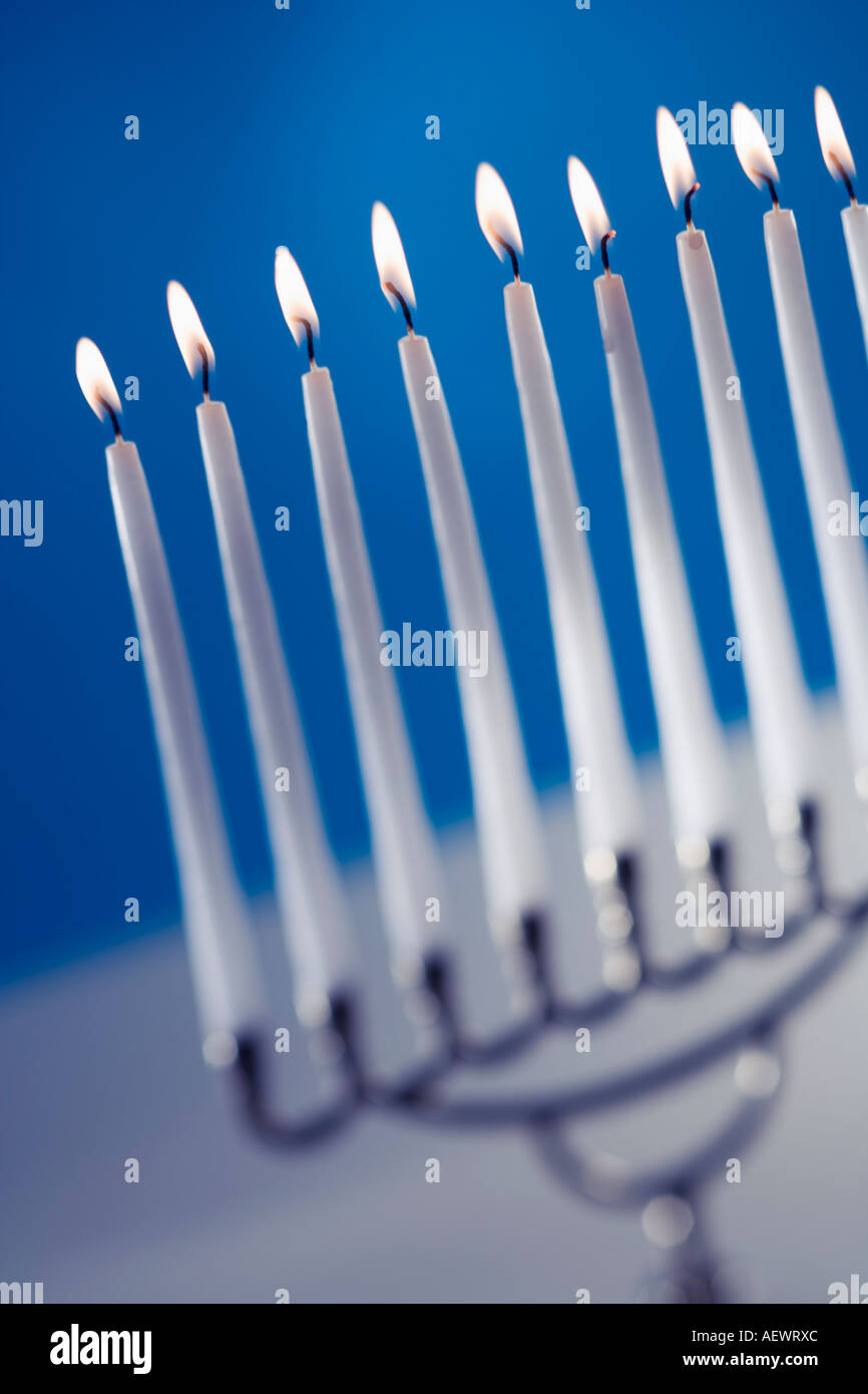 A fully lit menorah Stock Photo - Alamy