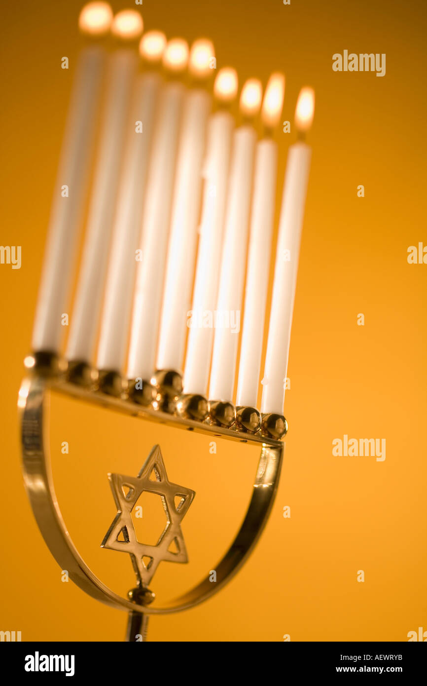 A fully lit menorah Stock Photo - Alamy