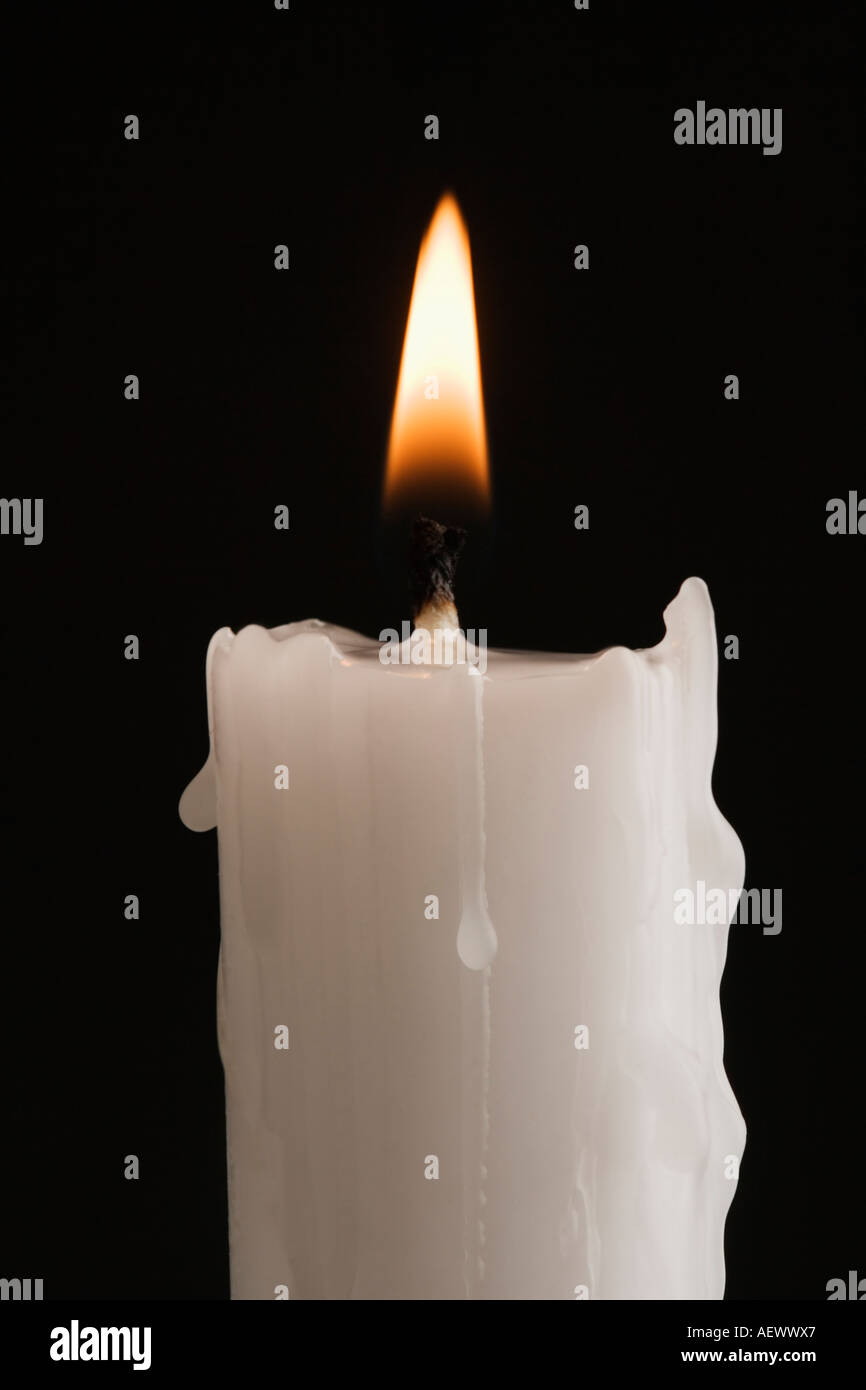 Closeup of a burning candle Stock Photo - Alamy