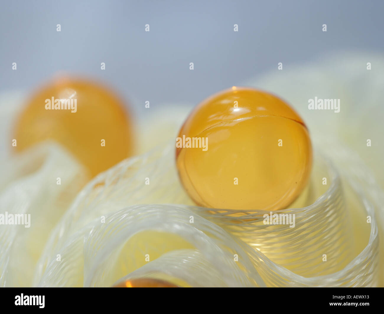 Close up of bath beads on a mesh Stock Photo - Alamy
