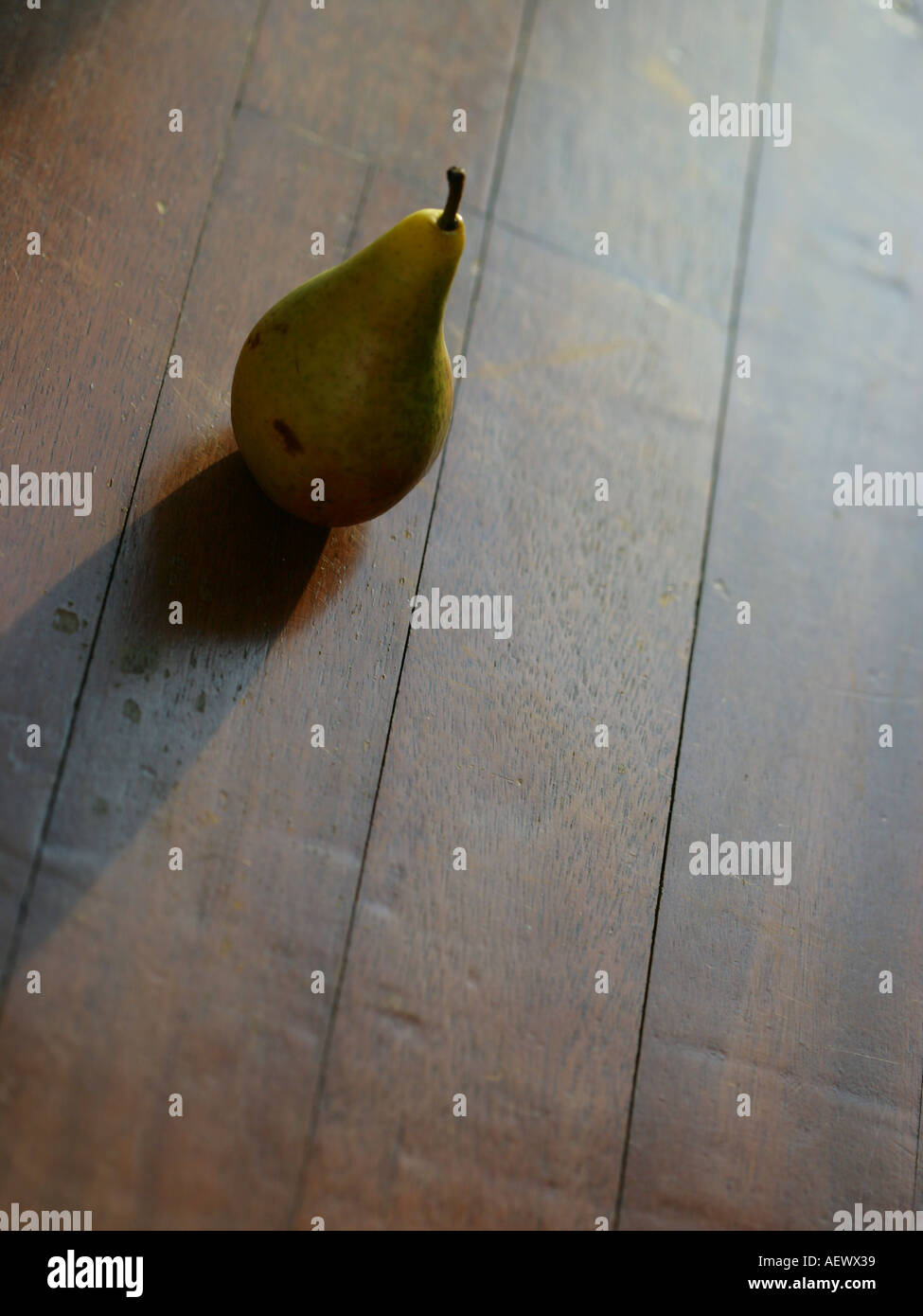 High angle view of bartlett pear on the hardwood floor Stock Photo - Alamy
