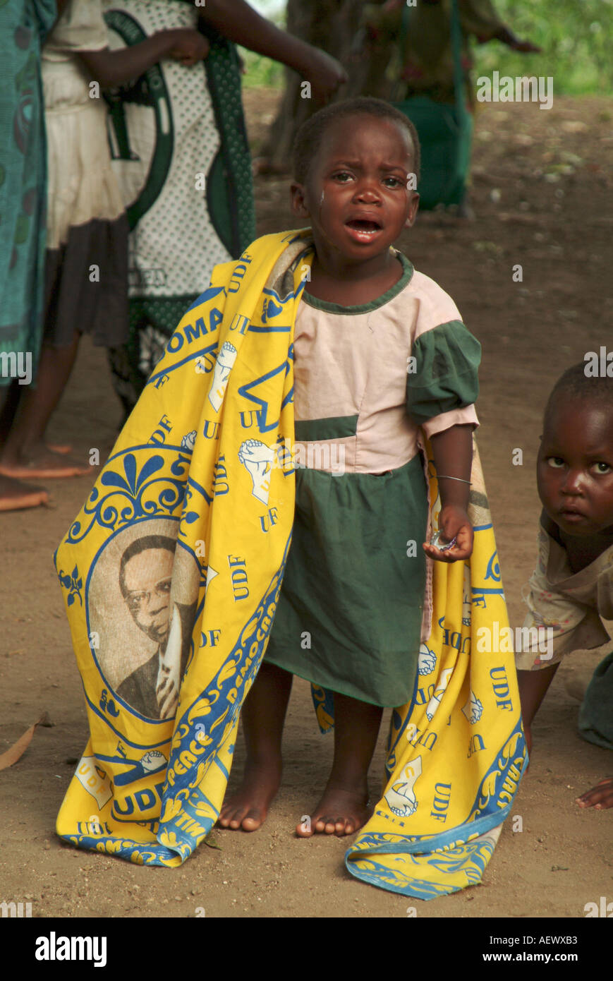 A crying child wears political cloth of Malawi's ruling party the UDF ...