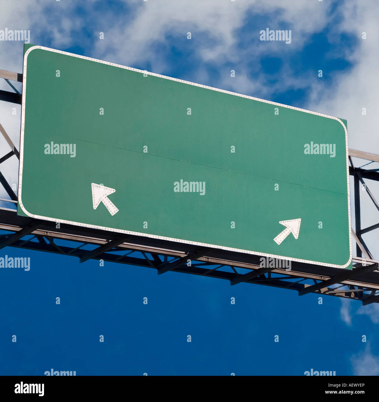 Blank single freeway sign with white arrows Stock Photo - Alamy
