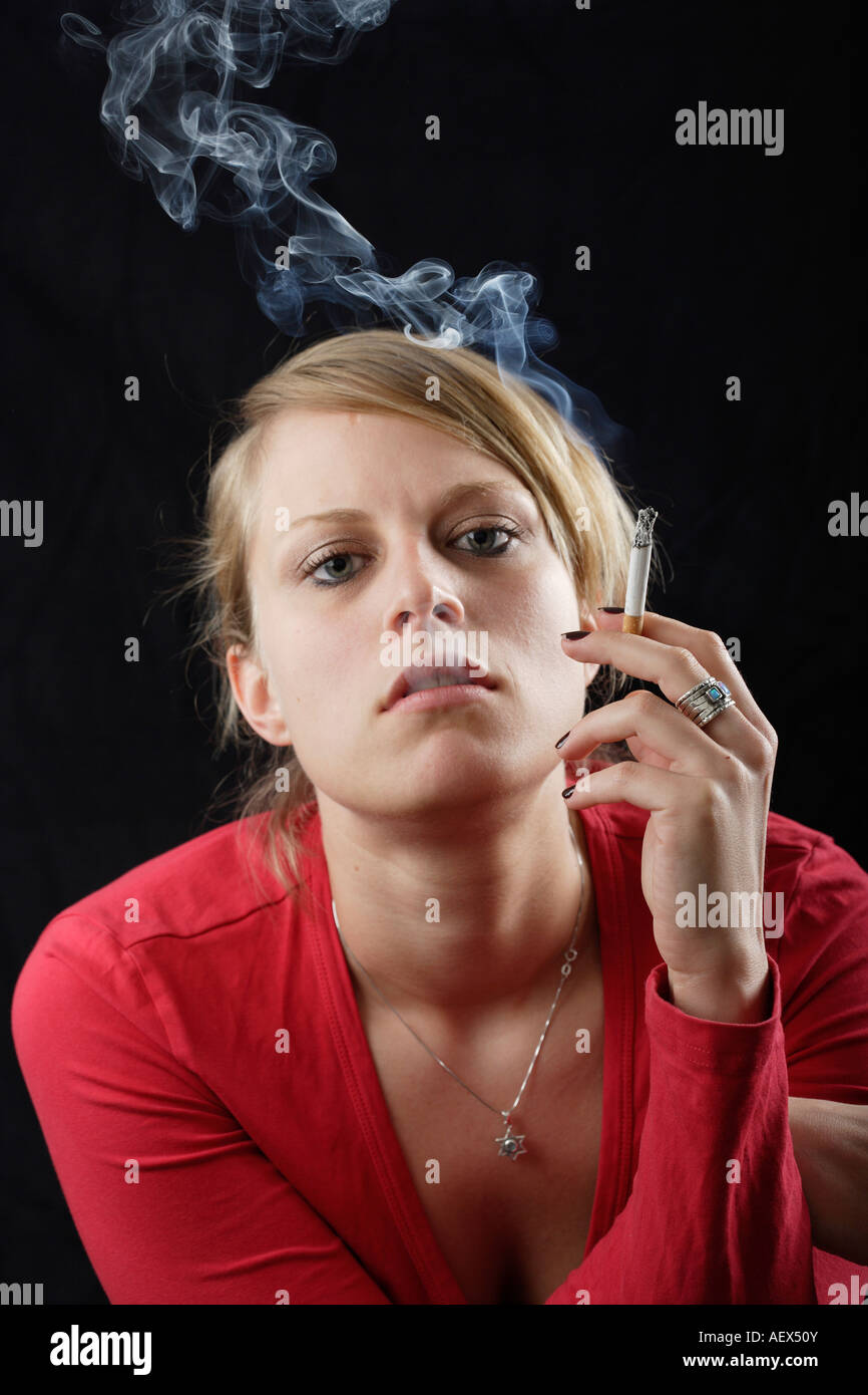Young woman smokes Stock Photo - Alamy