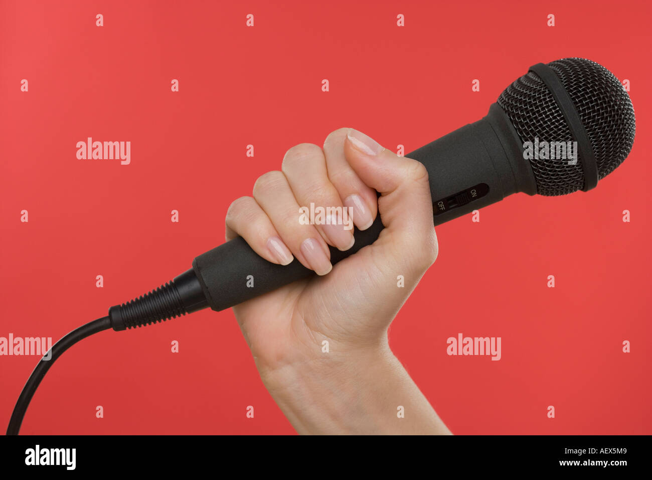Woman holding microphone closeup hand hi-res stock photography and ...