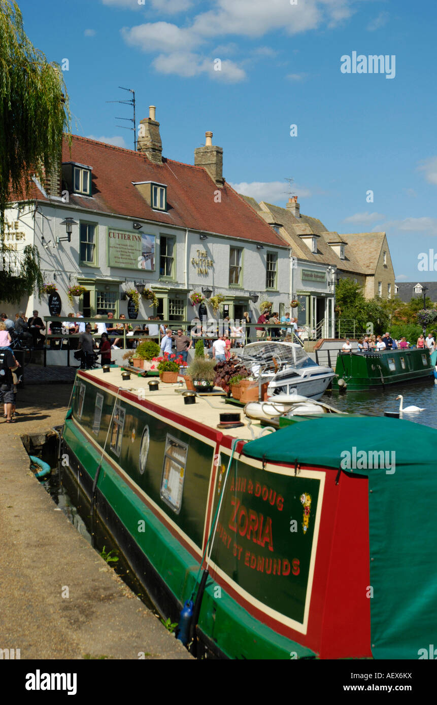 The Cutter Inn and colourful barge Ely Cambridgeshire England Stock ...