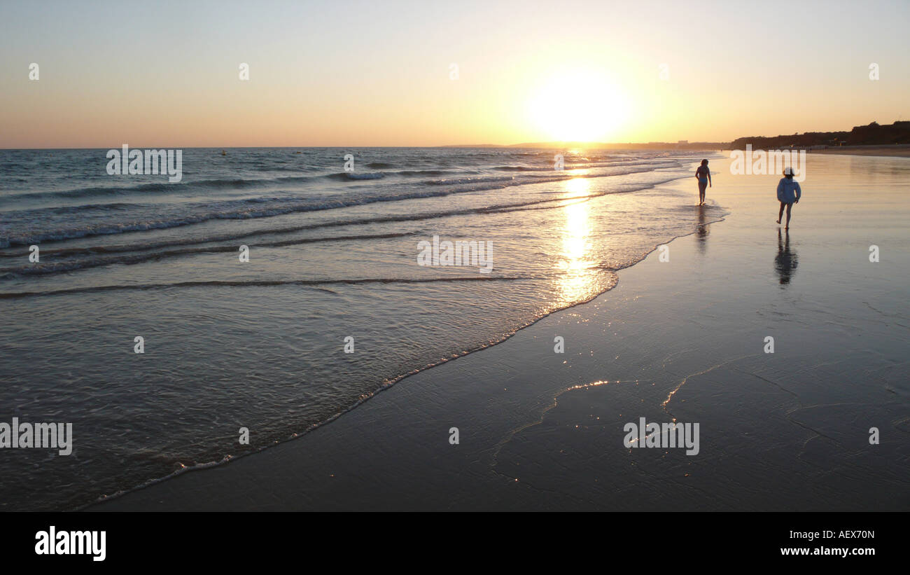 Sun sets on a summer beach Stock Photo - Alamy