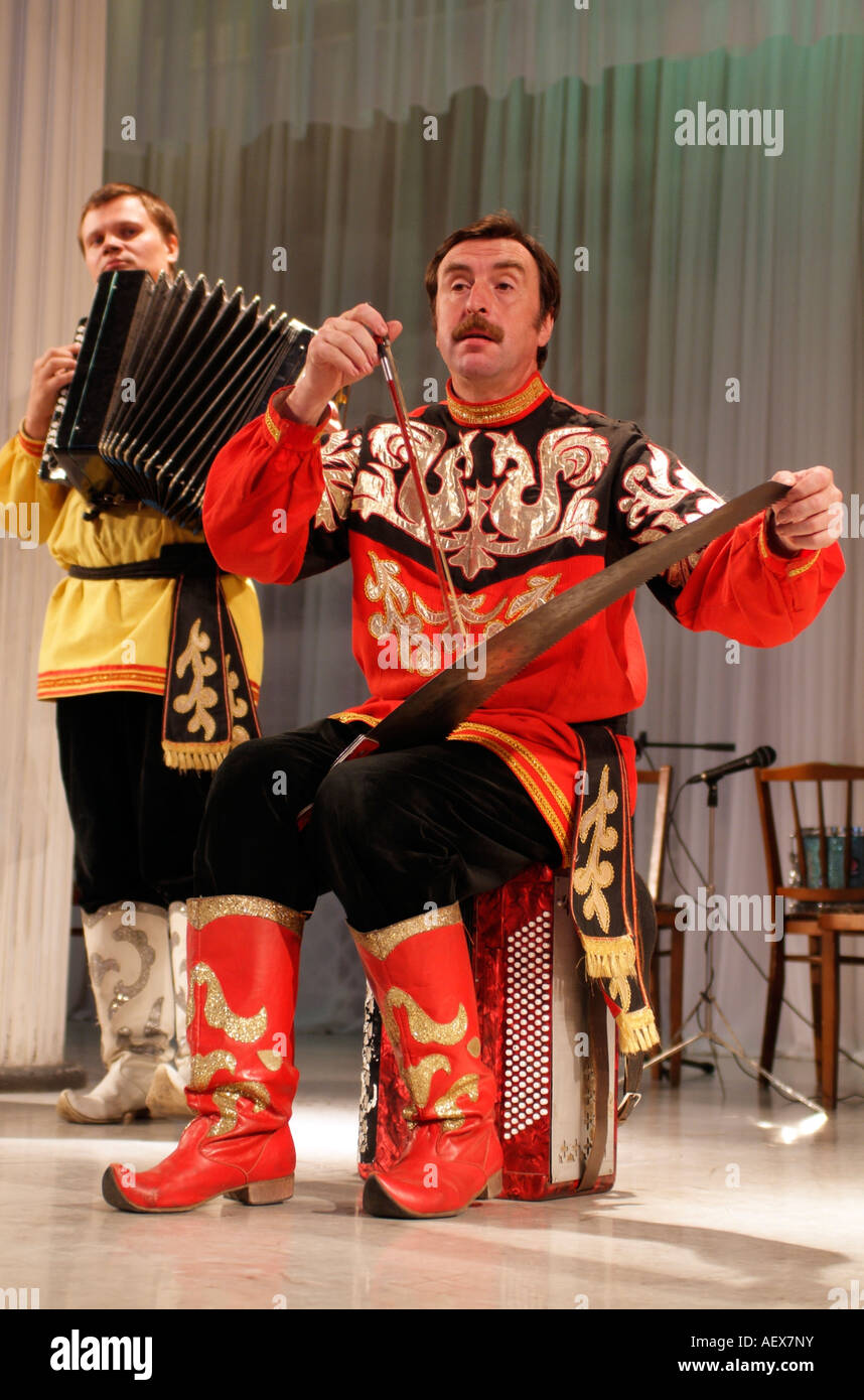 Musical saw player Russian musical entertainer in traditional costume ...