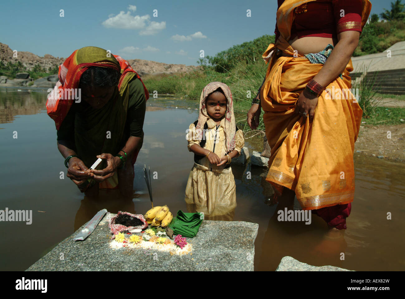 A young girl gets the Hindu equivalent of a western christian baptism ...