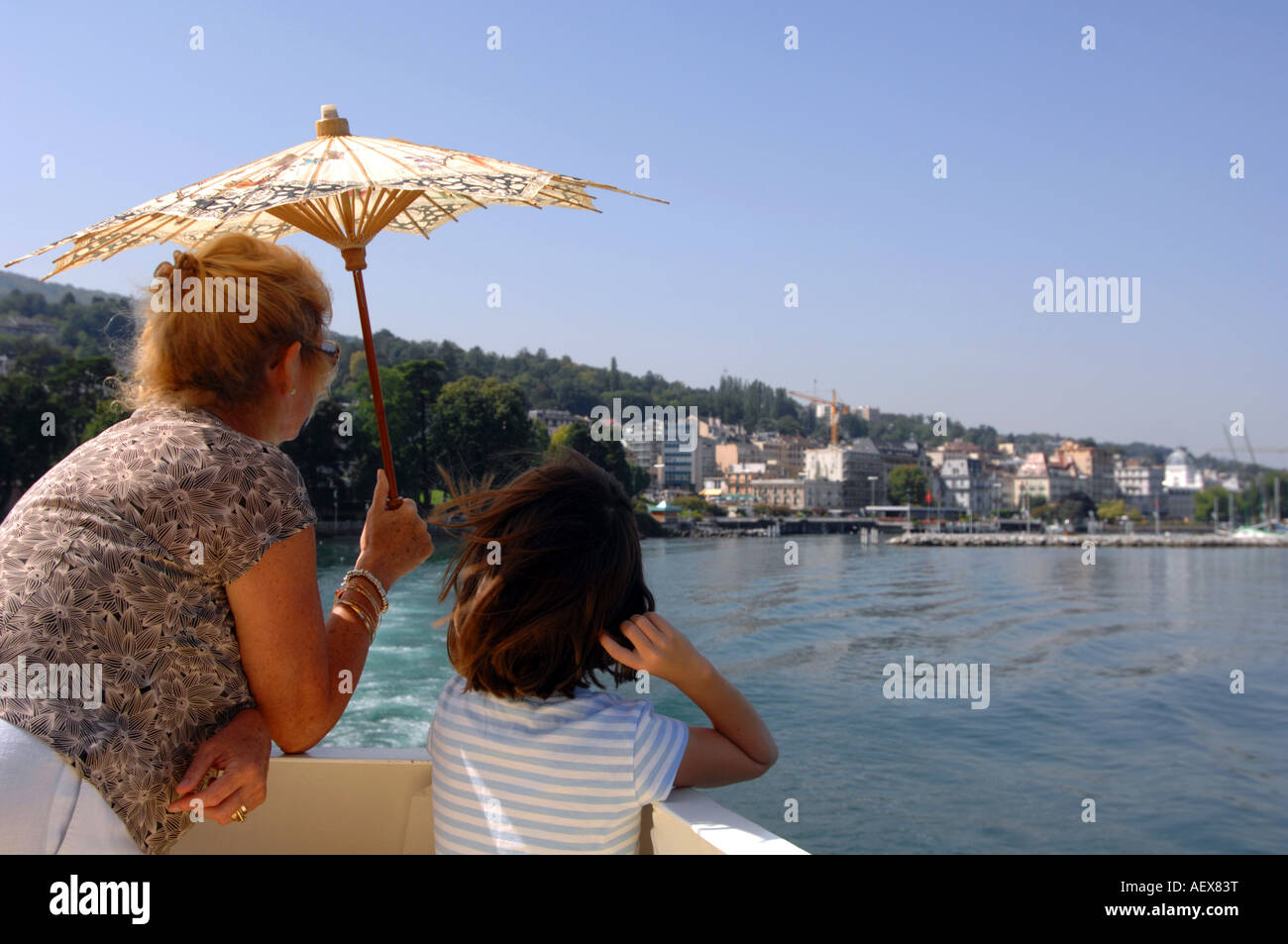 Cruise boat, passenger ferry leaving Evian on Lake Geneva, Lac Leman ...