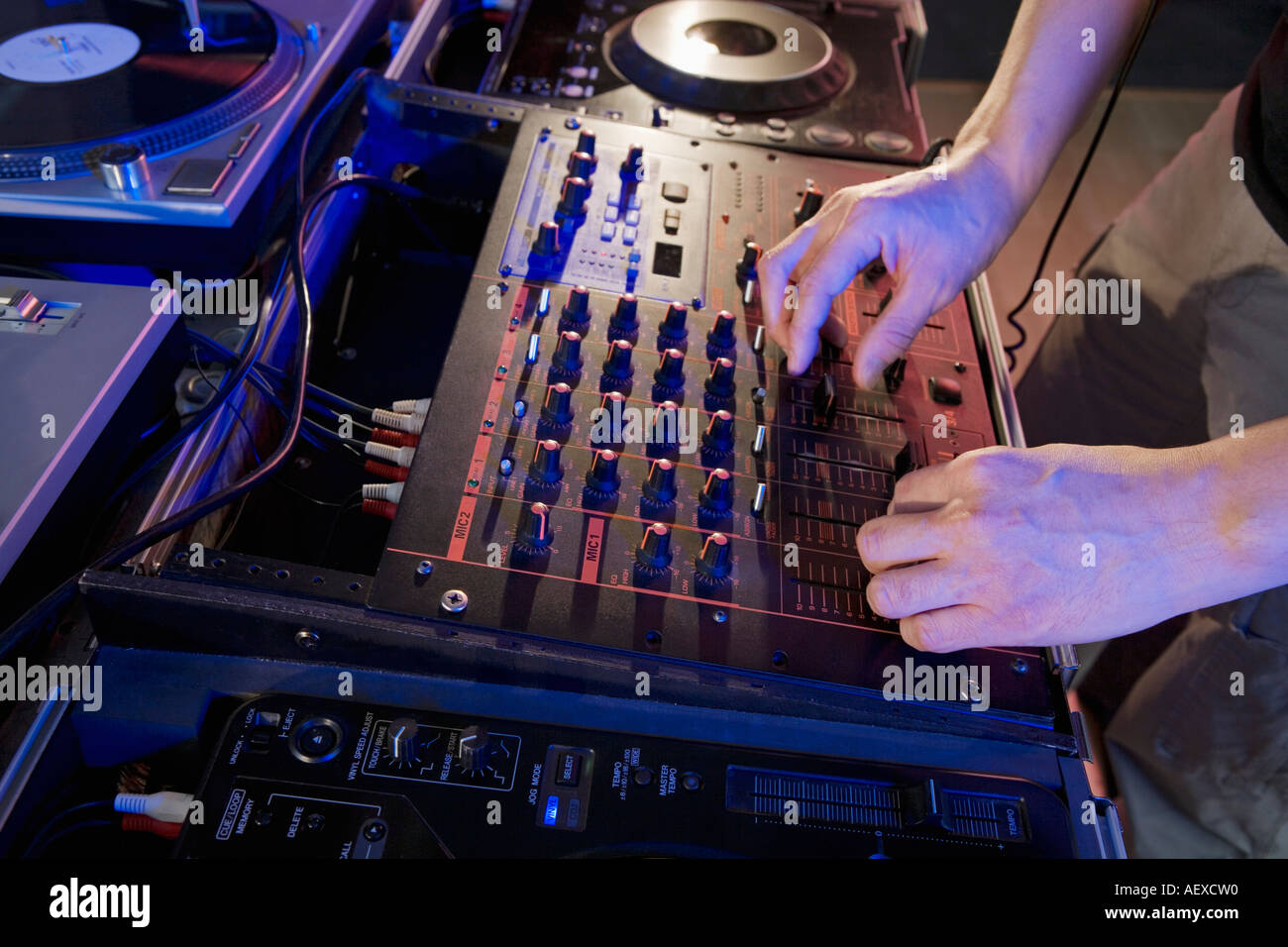 Hands working sound equipment Stock Photo - Alamy