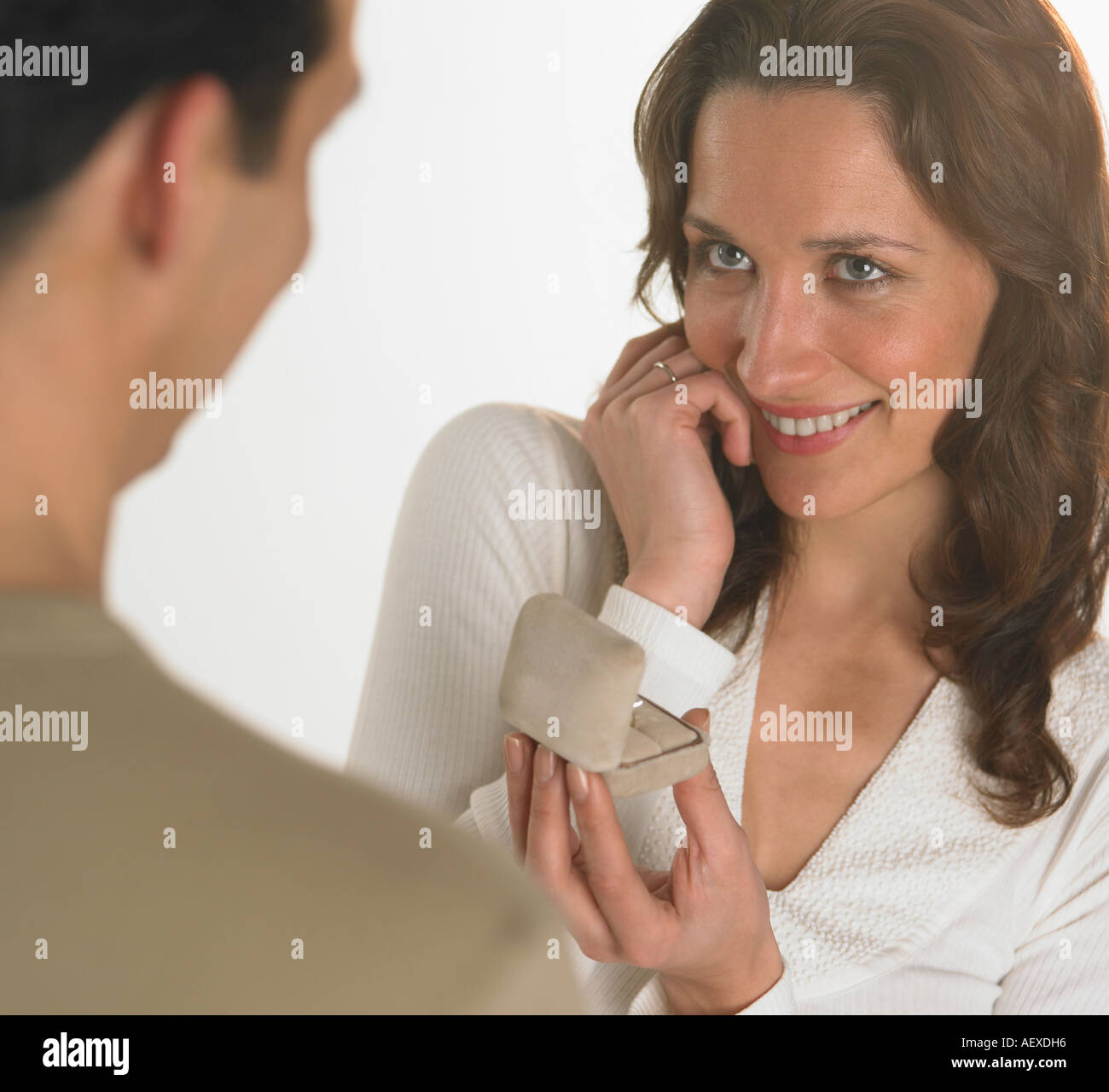 Man giving woman engagement ring Stock Photo - Alamy