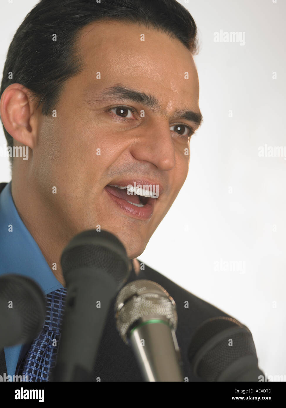 Speaking at microphones hi-res stock photography and images - Alamy