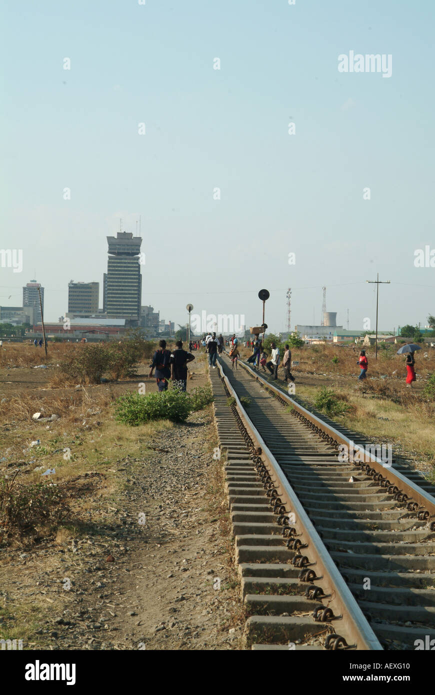 People walk along the Lusaka railway towards the Zambian Capital ...