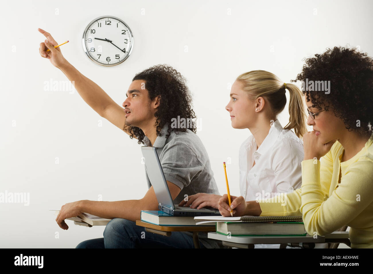 Three college students in class Stock Photo - Alamy