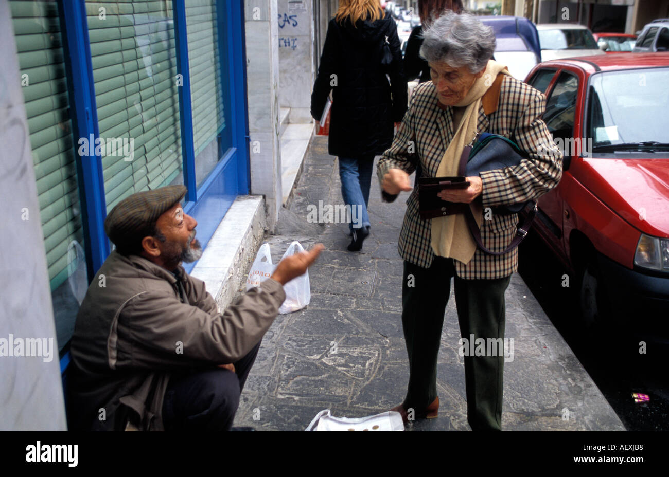Giving to the Poor Stock Photo - Alamy