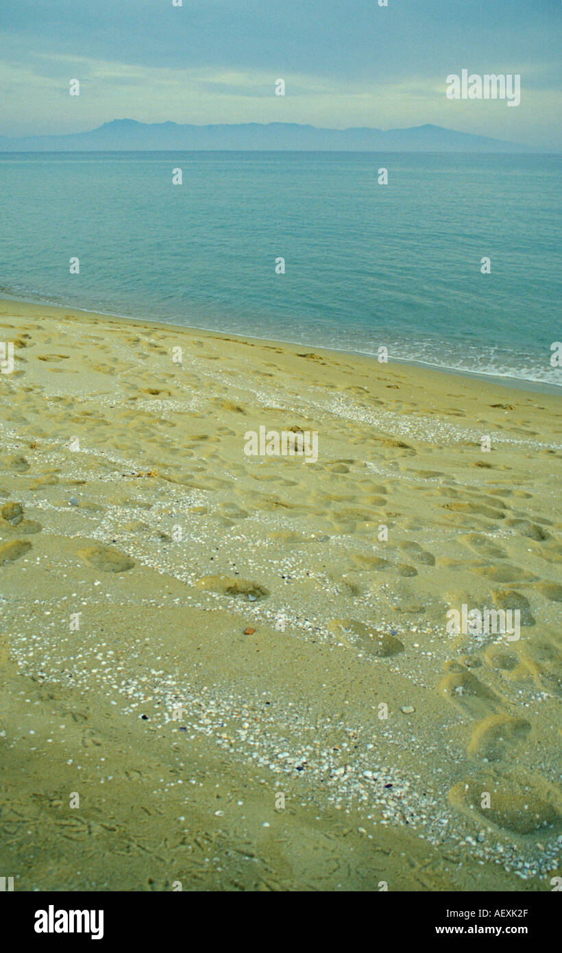 Peramos Beach. Viewed from a shell-strewn sandy beach on the mainland ...