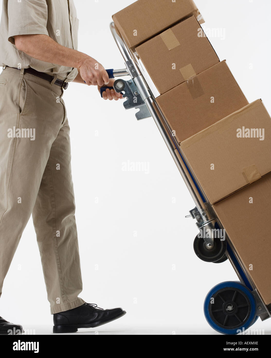 Delivery man with packages Stock Photo - Alamy