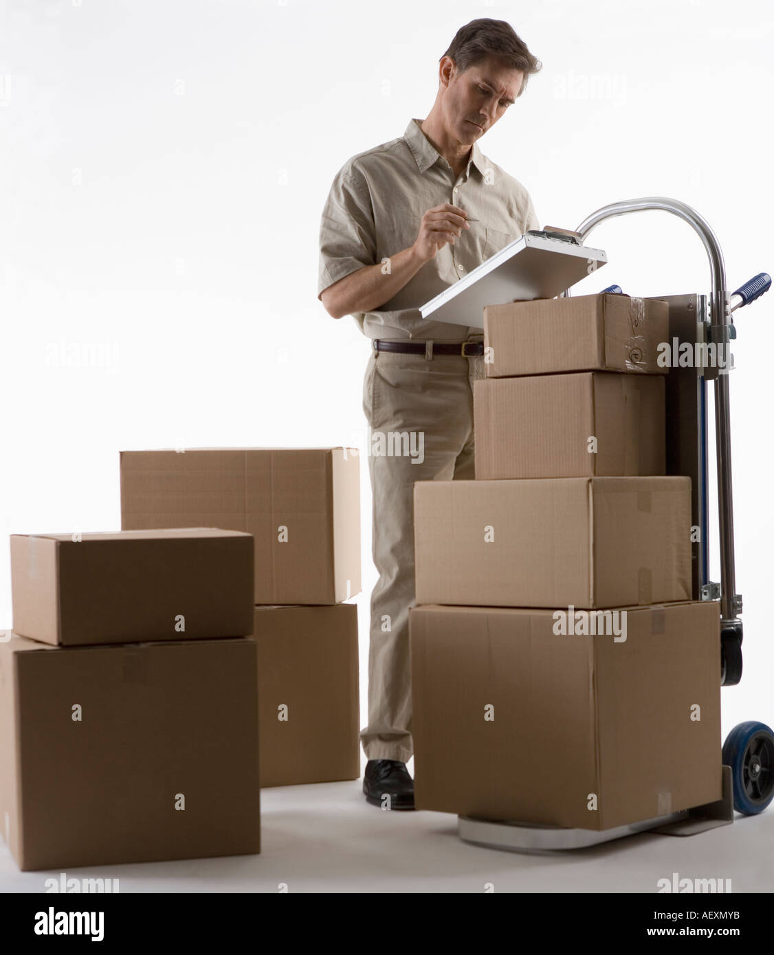 Delivery man with packages Stock Photo - Alamy