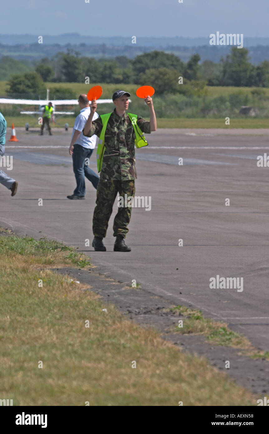 Cadets marshalling aircraft at the PFA Rally Stock Photo - Alamy