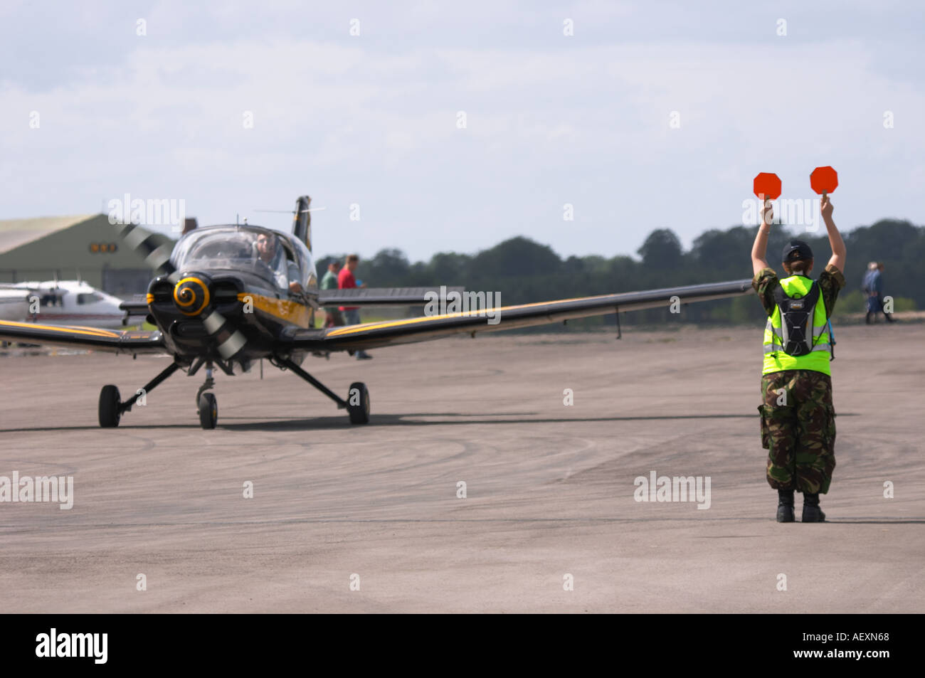 Cadets marshalling aircraft at the PFA Rally Stock Photo - Alamy