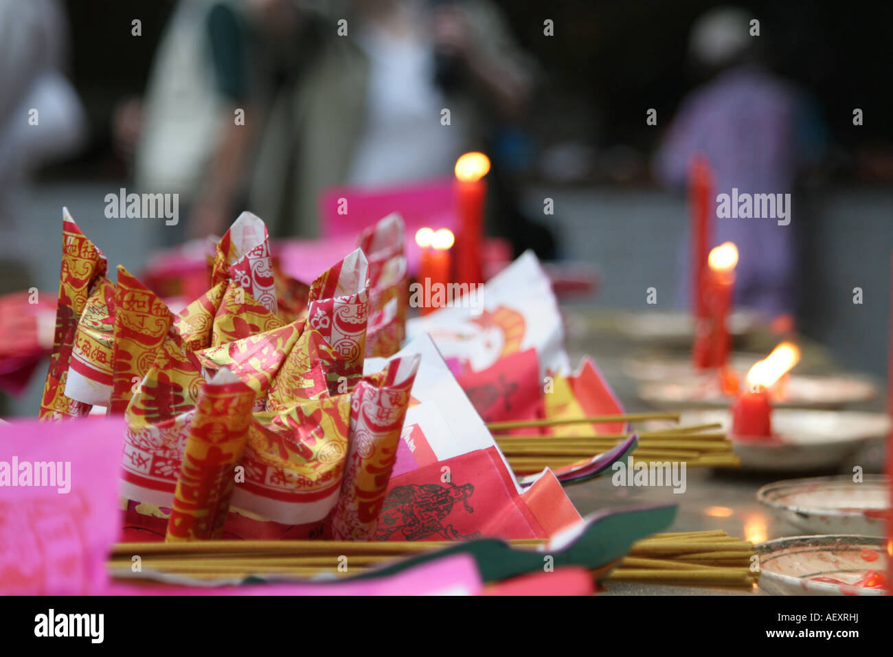 Small offerings and candles Stock Photo - Alamy