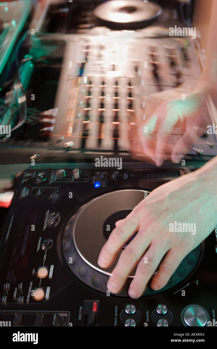 Person mixing music in a nightclub Stock Photo - Alamy