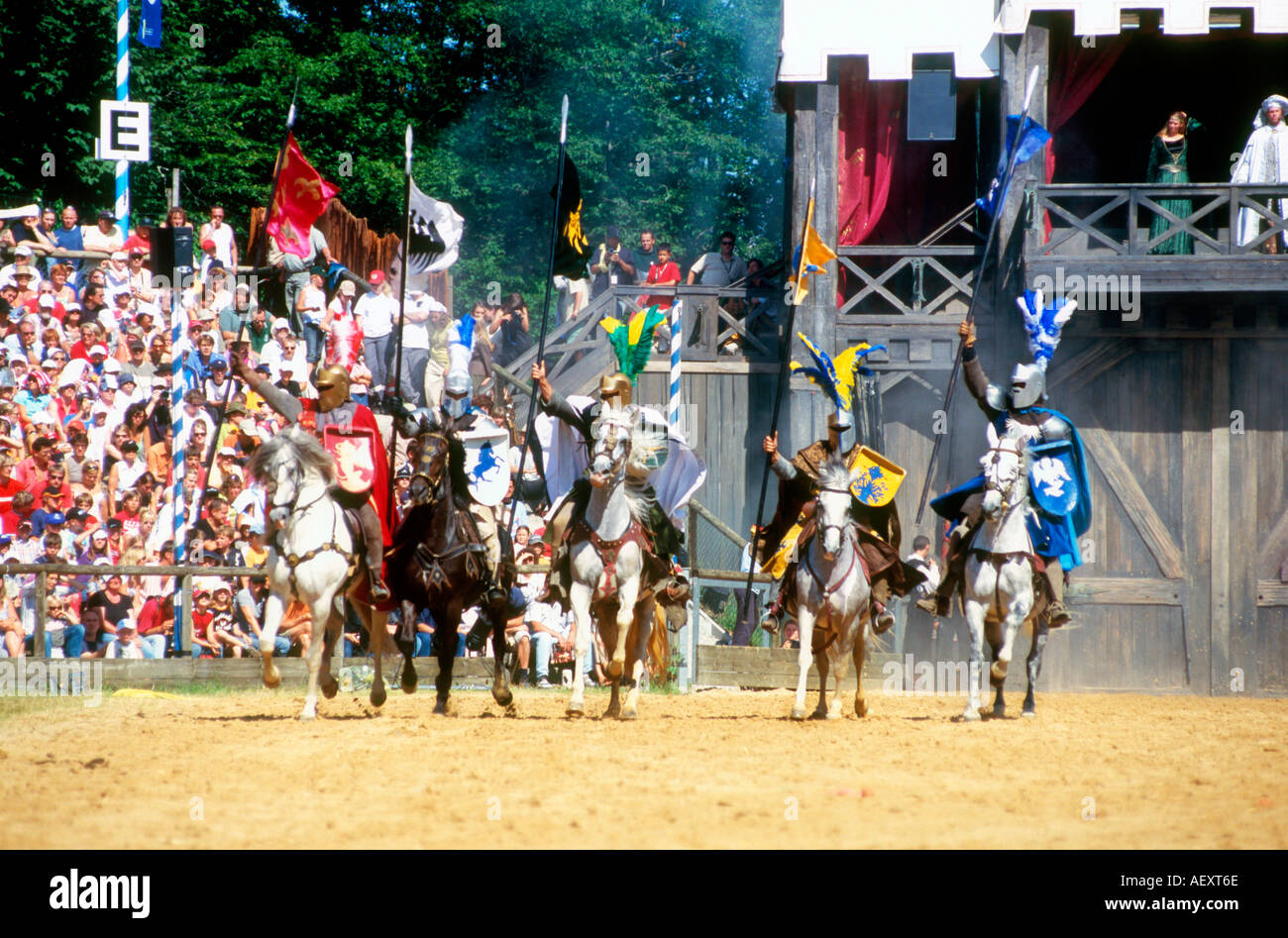 Knights on horse holding lance flag in tournament Medieval festival in ...