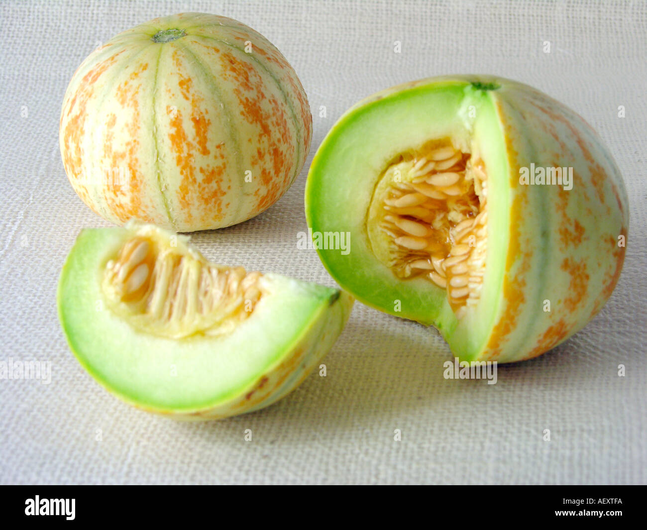 ADC71087 2 Two sweet melon fruit food juicy tasty round circular table ...