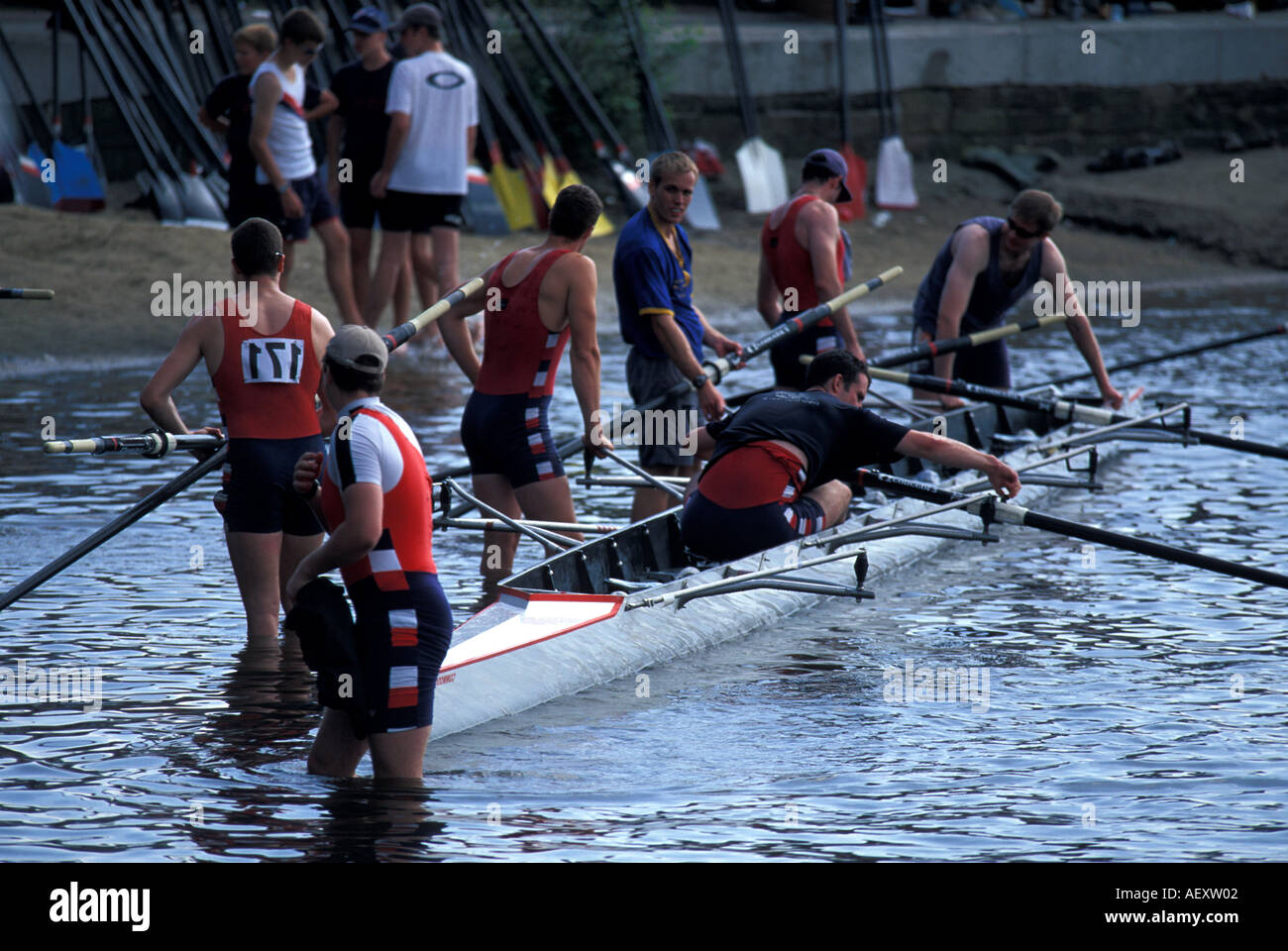 Landscape format image of a group of male rowers disembarking a long ...