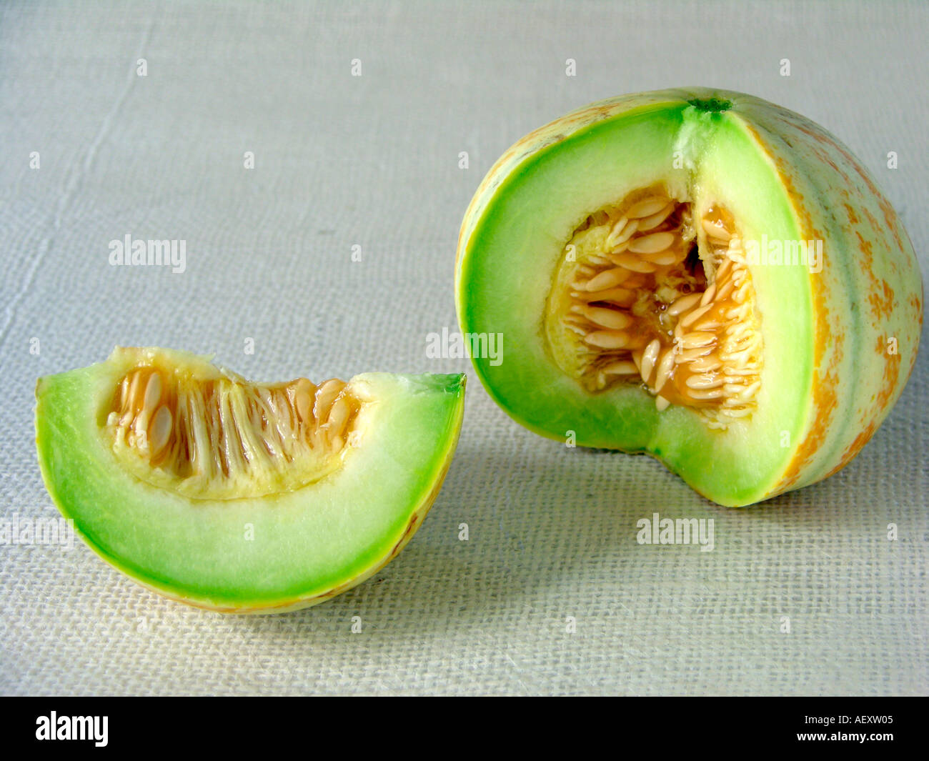 ADC71088 One open cut sweet melon fruit food juicy tasty round circular ...