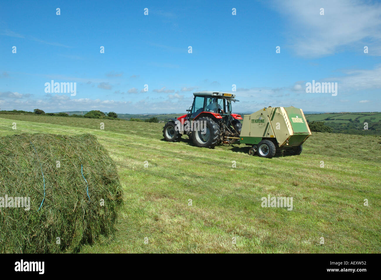 Hay baling round bales in field Stock Photo - Alamy