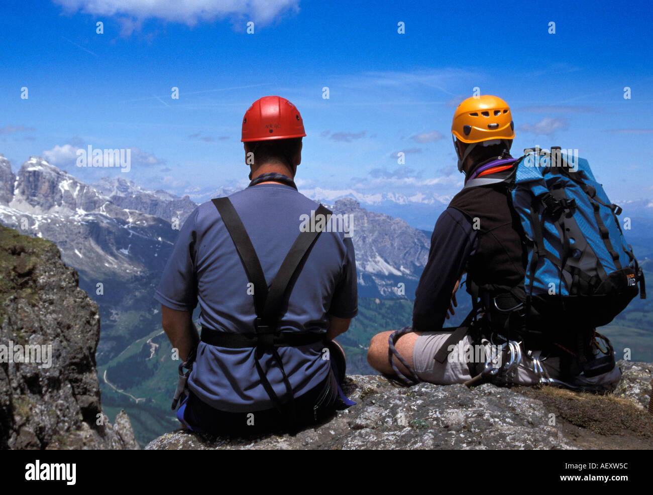 Two climber friends admiring the view after a successful climb in the ...