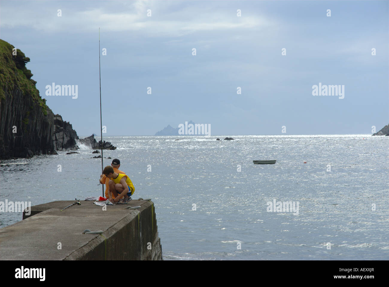Father and Son Fishing, Glen Cove, (Skelligs on Horizon), County Kerry ...