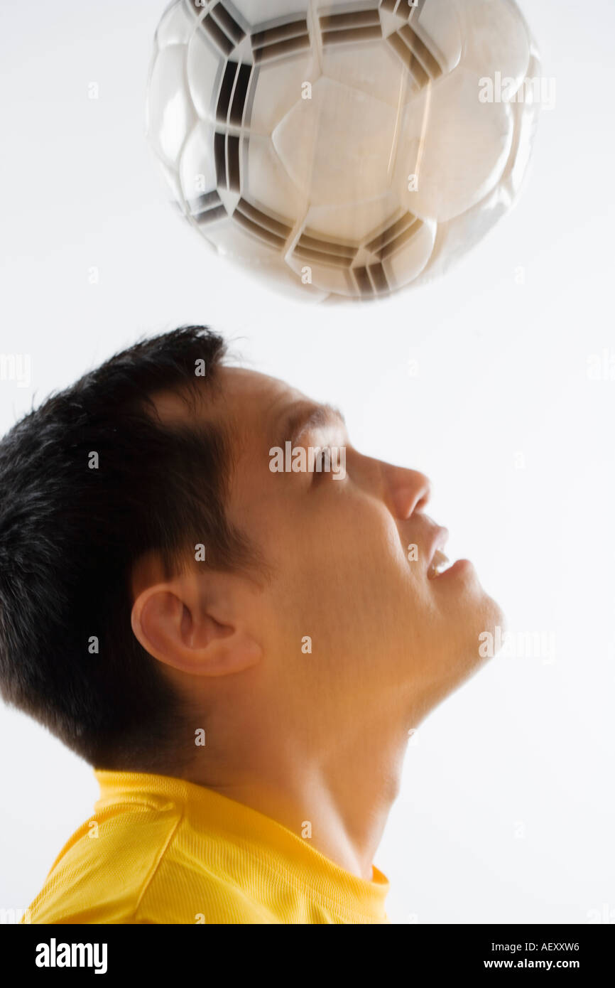 Man playing with soccer ball Stock Photo - Alamy