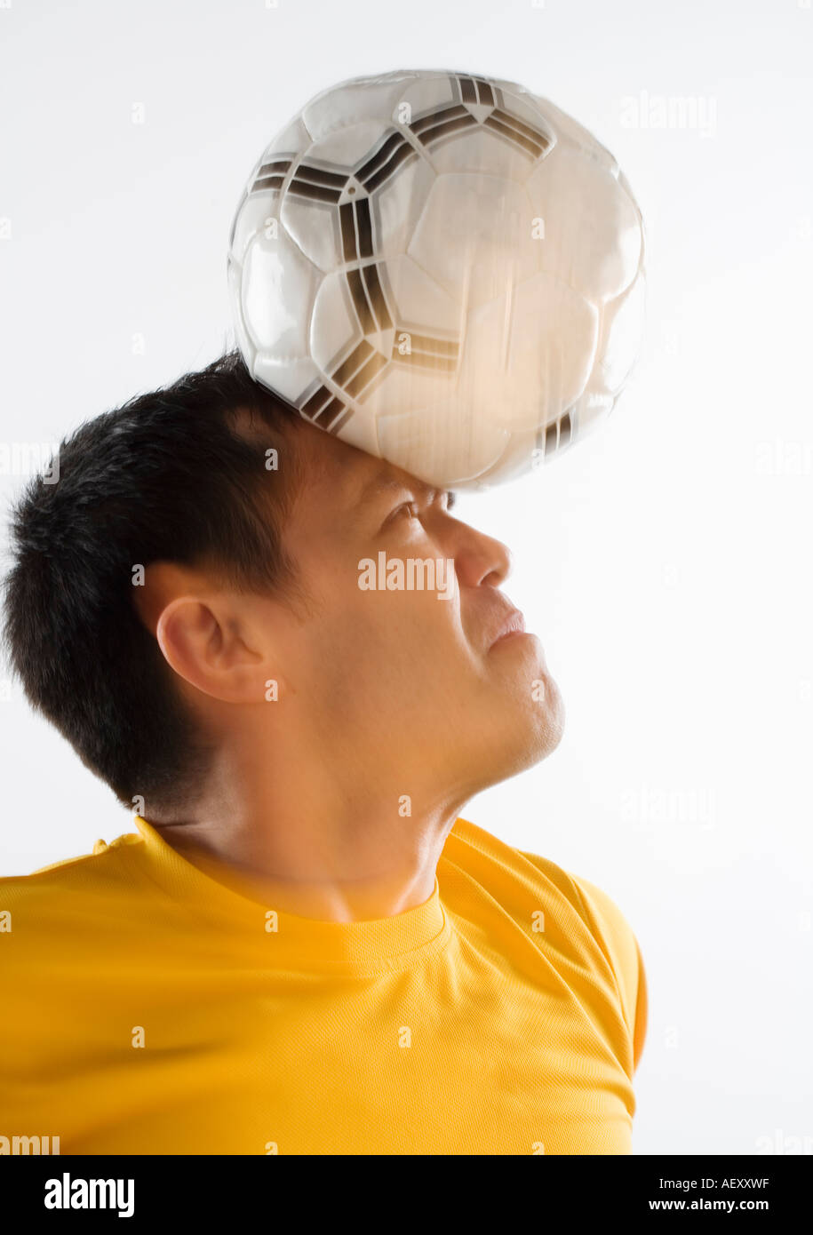 Man playing with soccer ball Stock Photo - Alamy