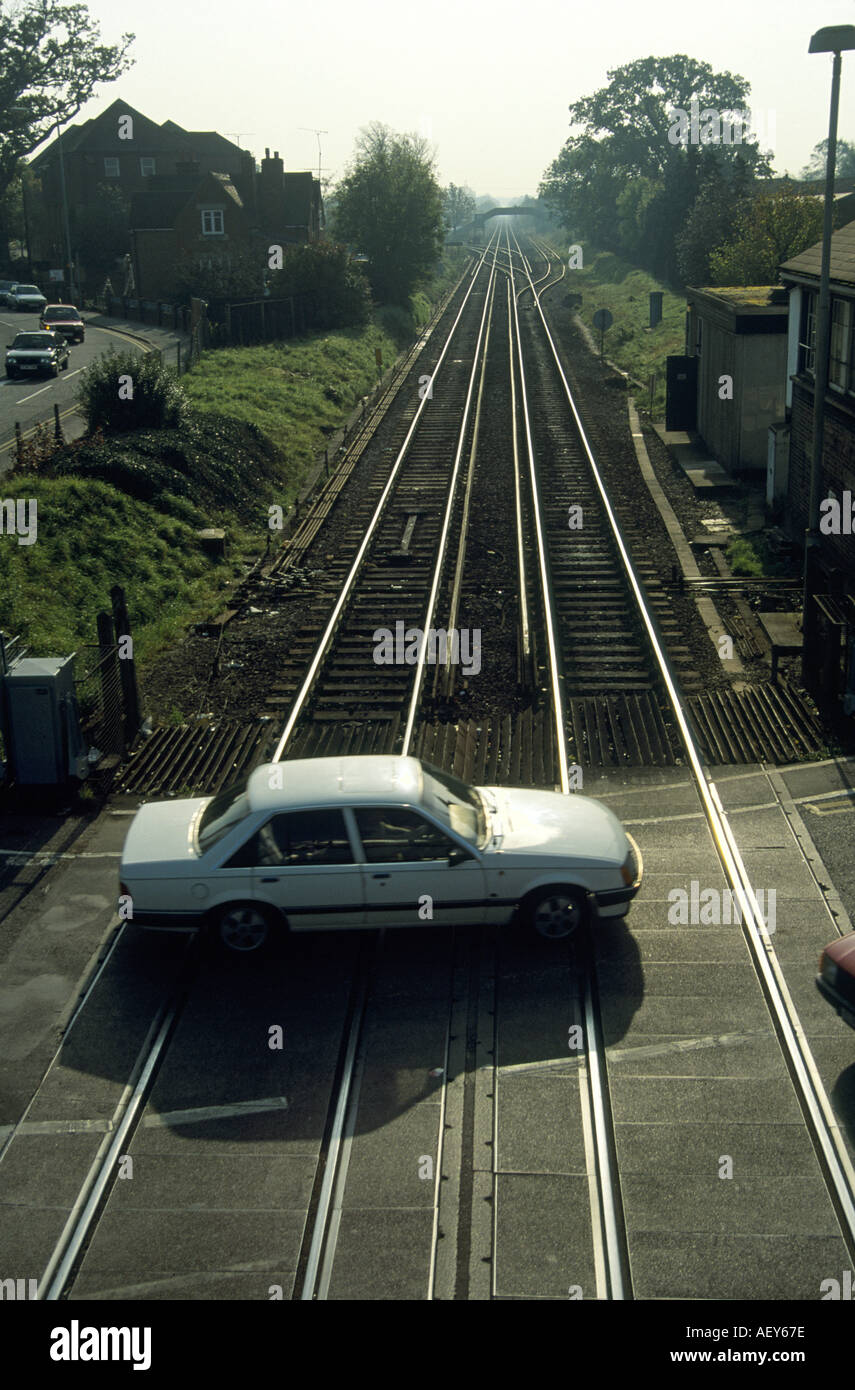 Car driving over a level crossing Stock Photo - Alamy