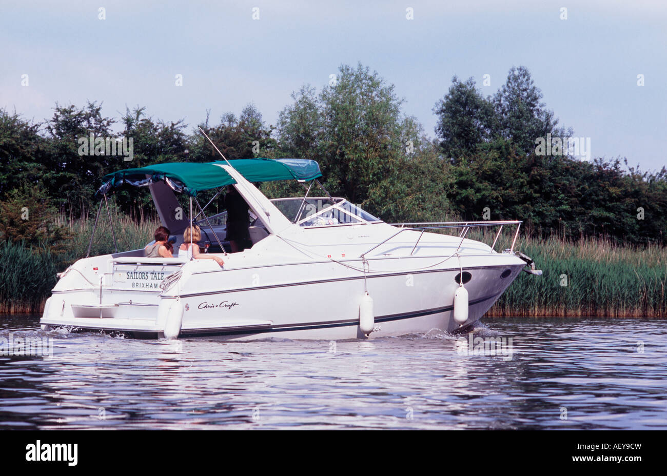 New Chris Craft motor cruiser before reed beds on River Thames above ...